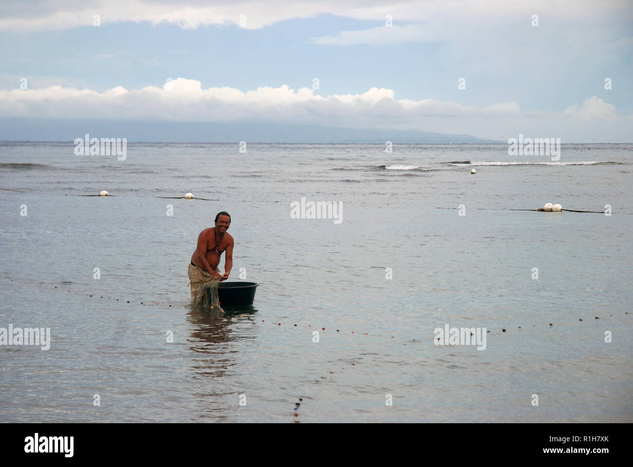 Man fishing in sea, Escano Beach, Dumaguete, Negros Oriental ...