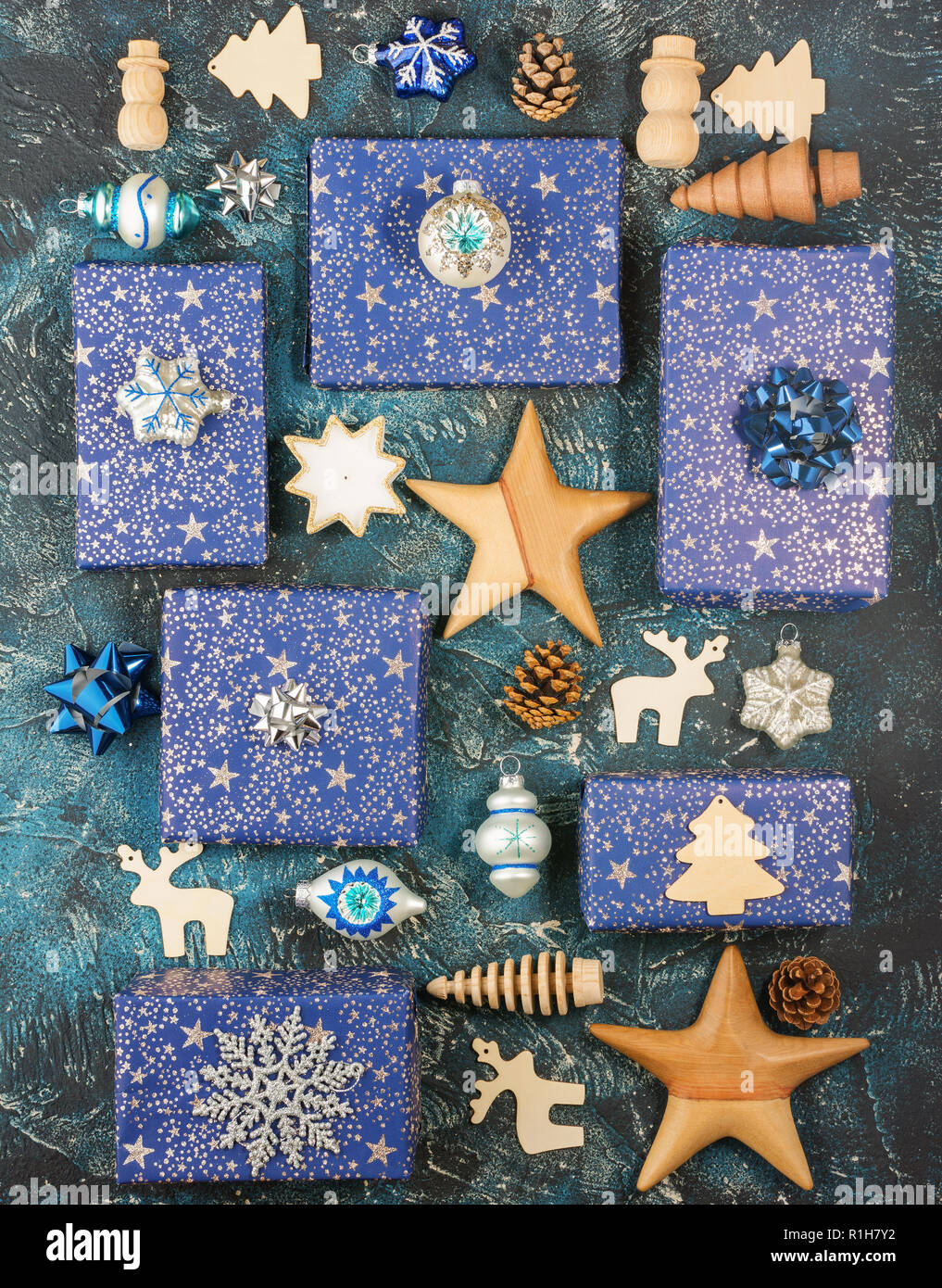 Creative chritmas arrangement. Presents in dark blue wrapping paper ...