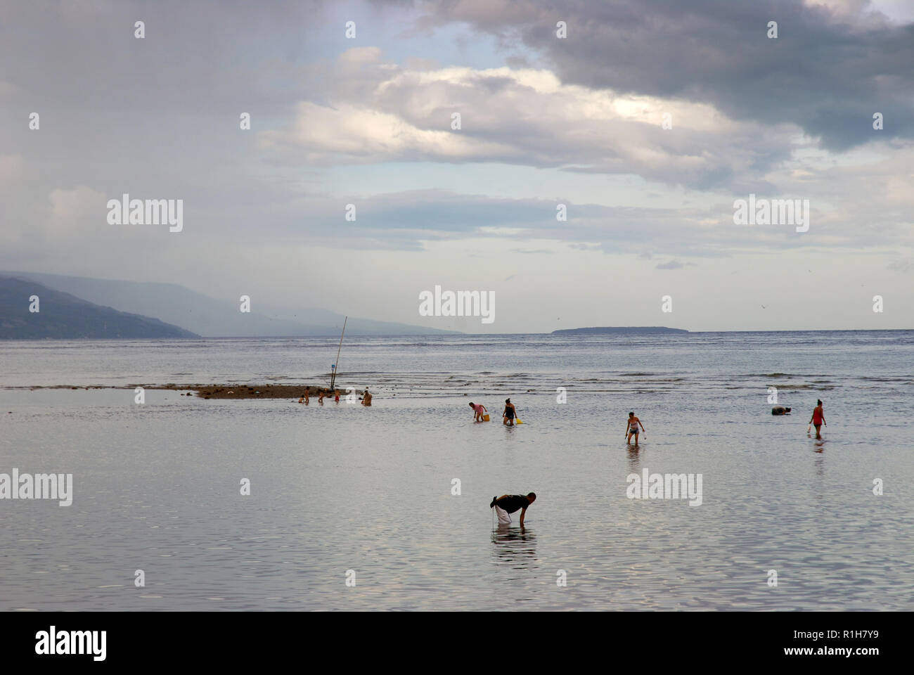 People fishing in sea, Escano Beach, Dumaguete, Negros Oriental ...
