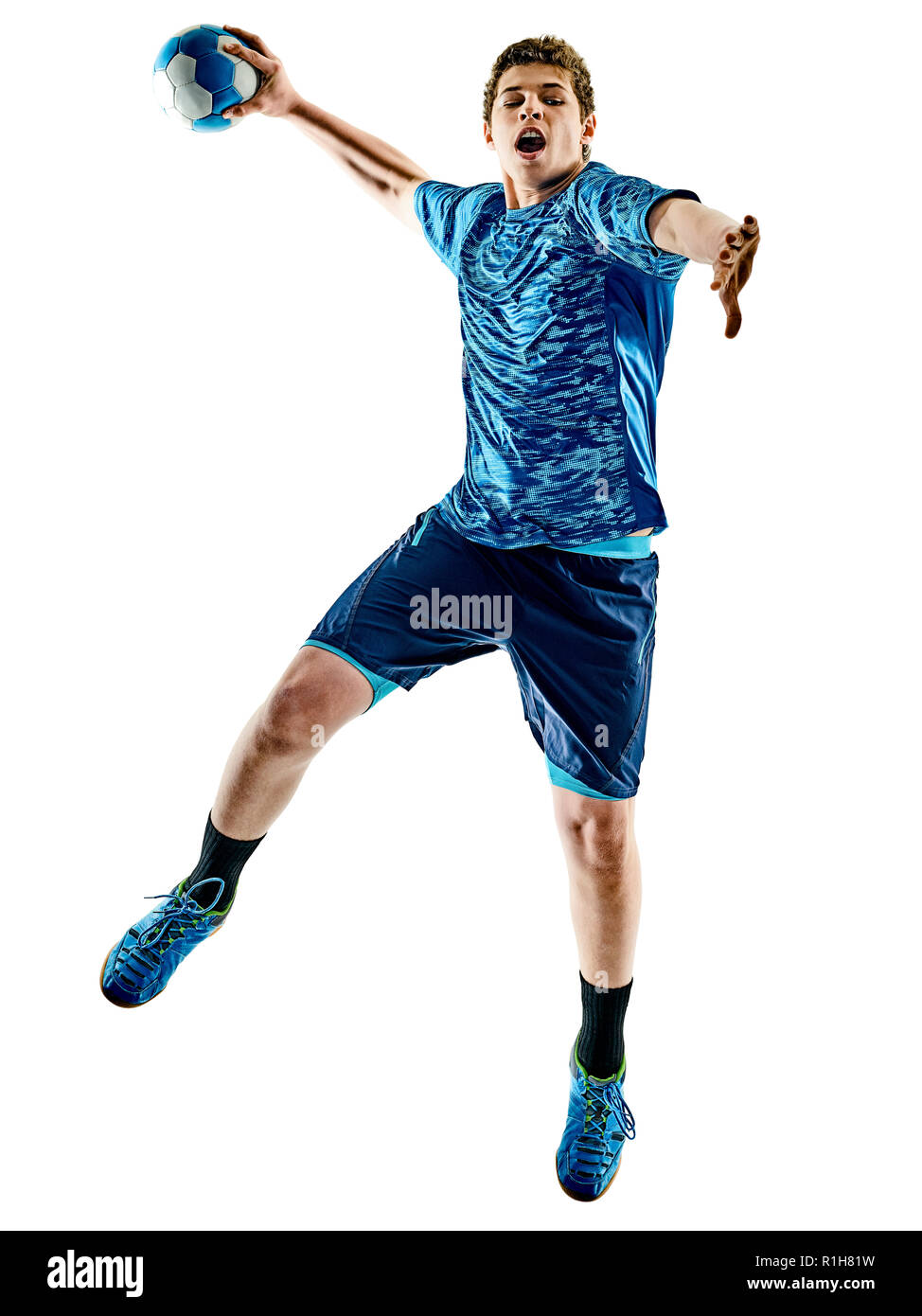 one caucasian handball player teenager boy in studio isolated on white ...