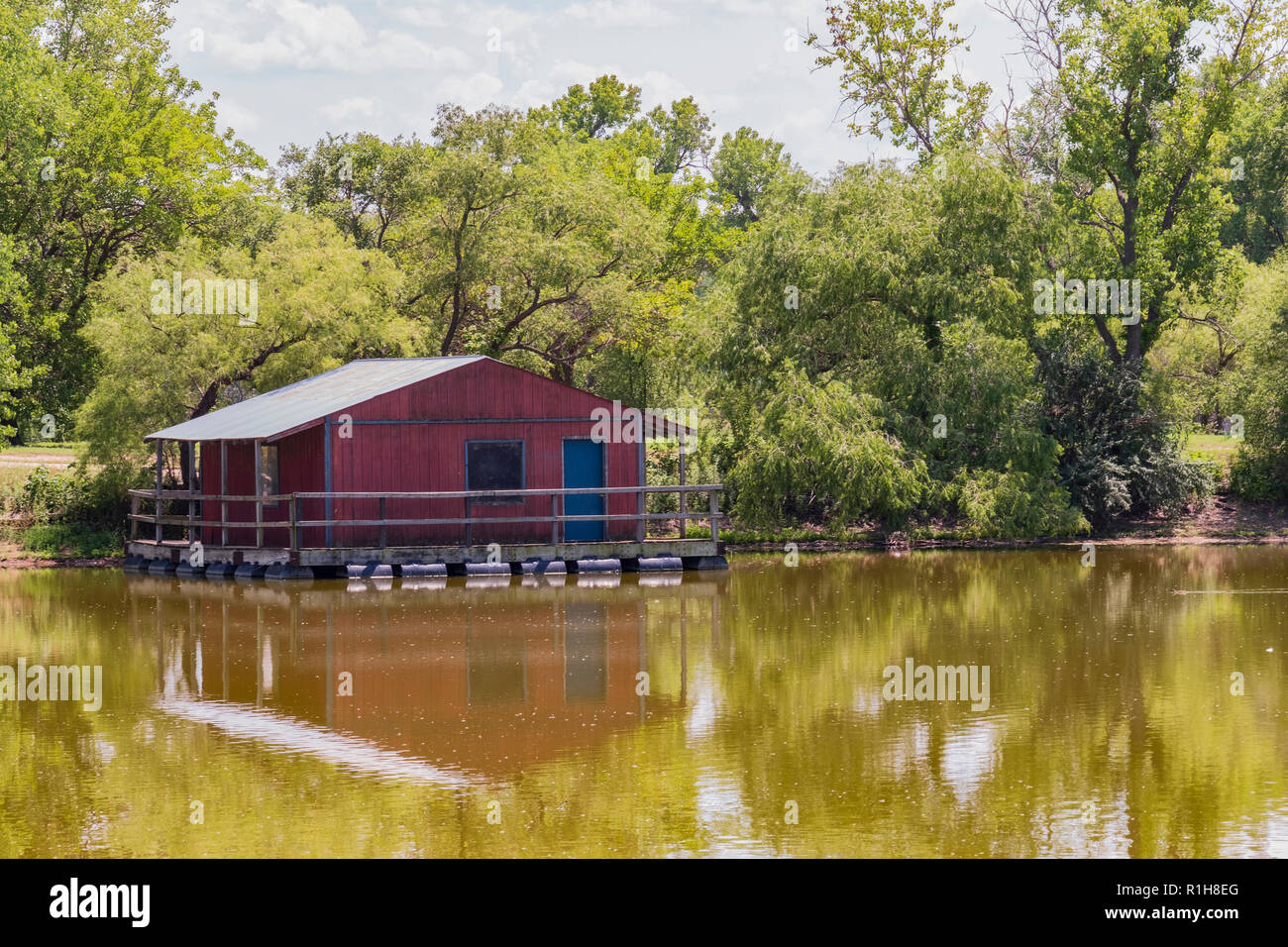 A floating fishing dock on a lake in Sedwick County park in Wichita ...