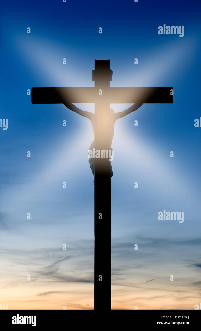 Holy Jesus Christ on the Cross With Sunset and Light Beam Stock Photo ...