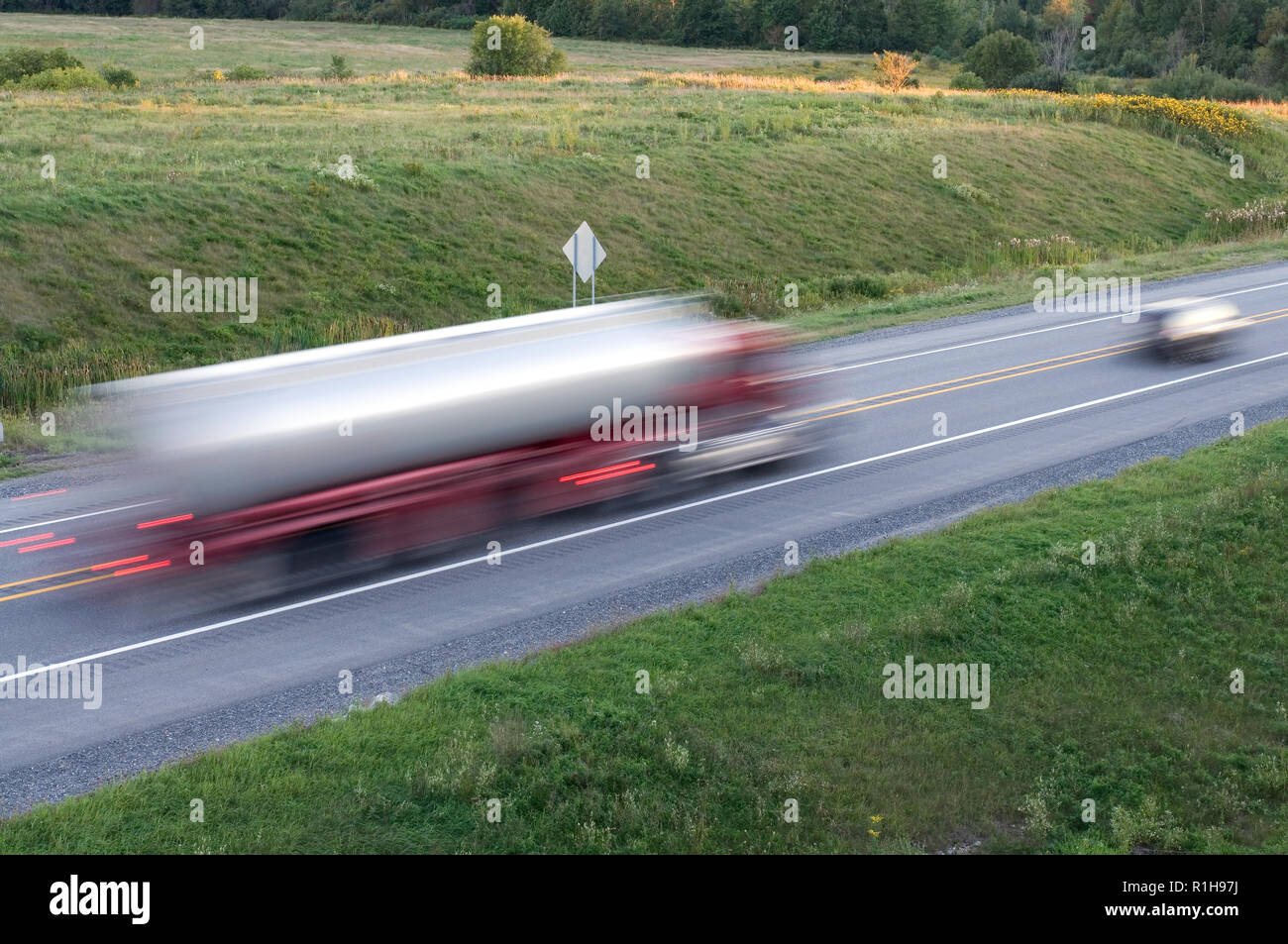 Red Tractor Trailer in Motion on a Major Highway Stock Photo - Alamy