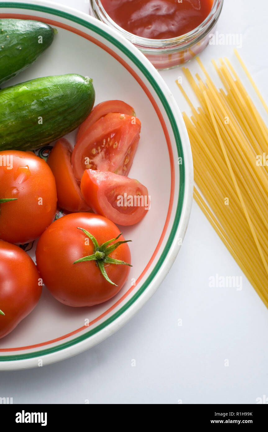 Beautiful Fresh Tomatoes and Cucumbers in a White Bowl with Spaghetti ...