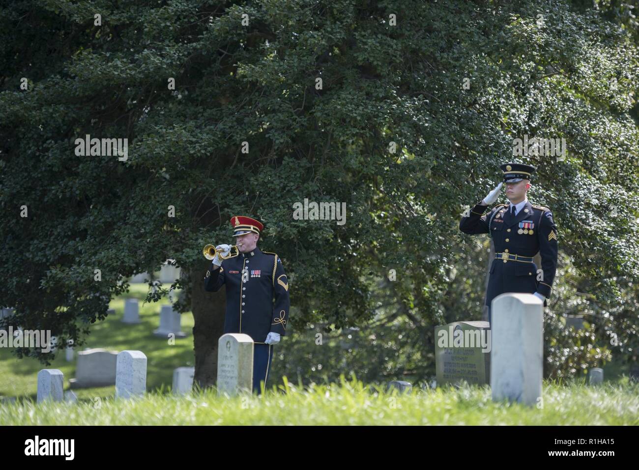 A bugler from The U.S. Army Band, "Pershing's Own", sounds Taps during ...