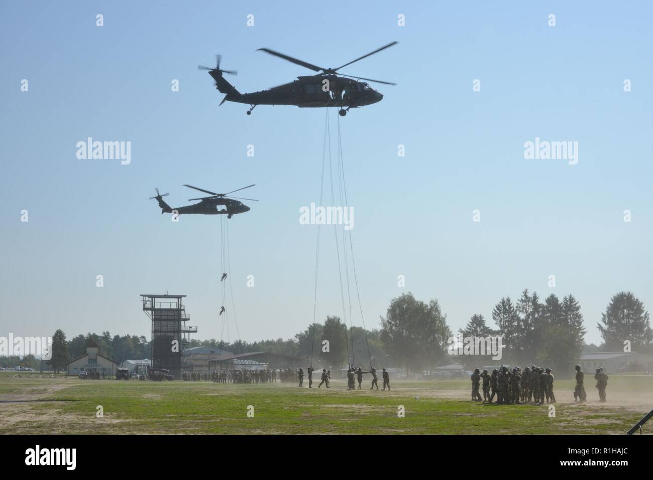 U.S. Soldiers rappel from UH-60M Black Hawk helicopters during an air ...