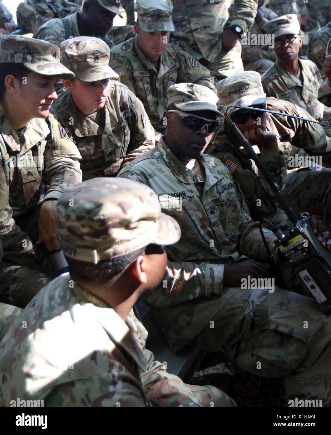 Sgt. Jaquan Brown (center), a motor transport operator with 396th ...