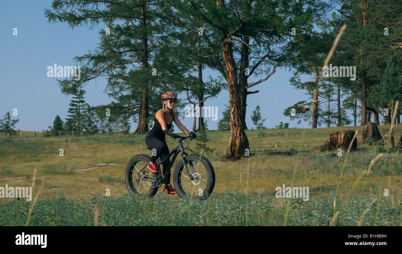 Fat bike also called fatbike or fat-tire bike in summer riding in the ...