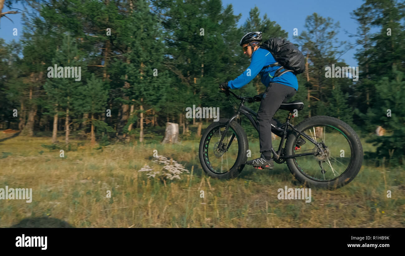 Fat bike also called fatbike or fat-tire bike in summer riding in the ...