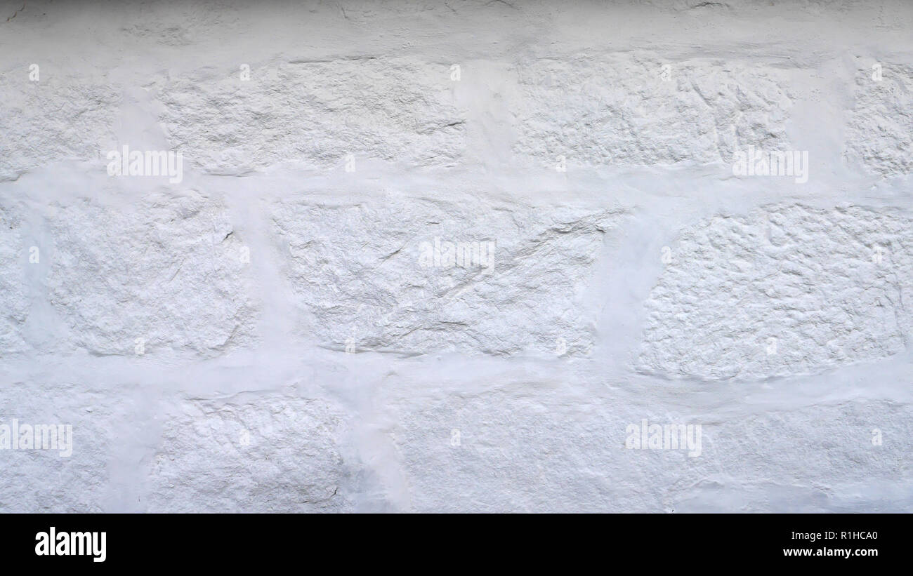 Rustic white wall texture and background. Uneven, imperfect old bricks ...