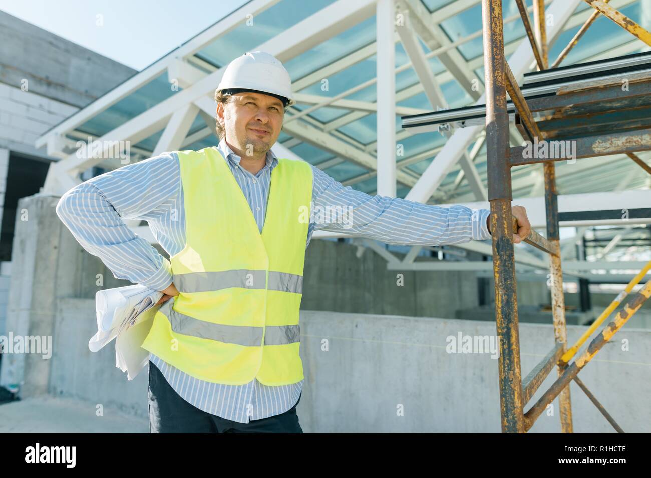 Portrait of male engineer at construction site. Building, development ...