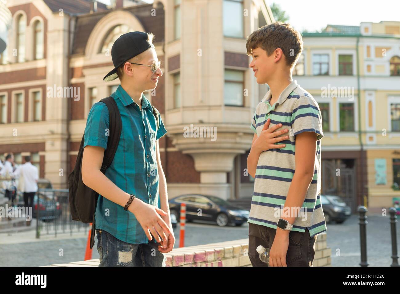Two male friends talking street hi-res stock photography and images - Alamy