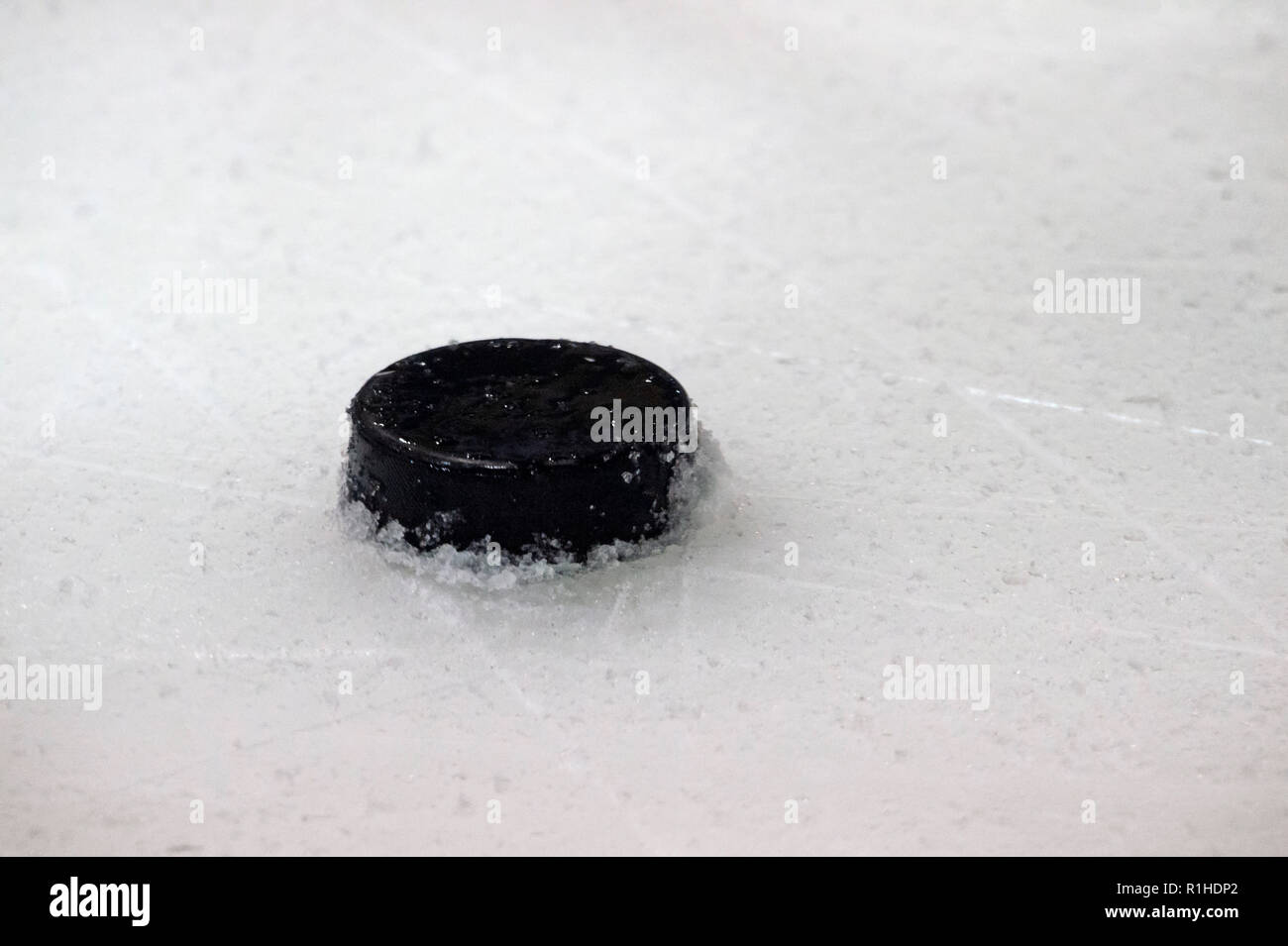 Ice hockey stick puck helmet and skates hi-res stock photography and ...