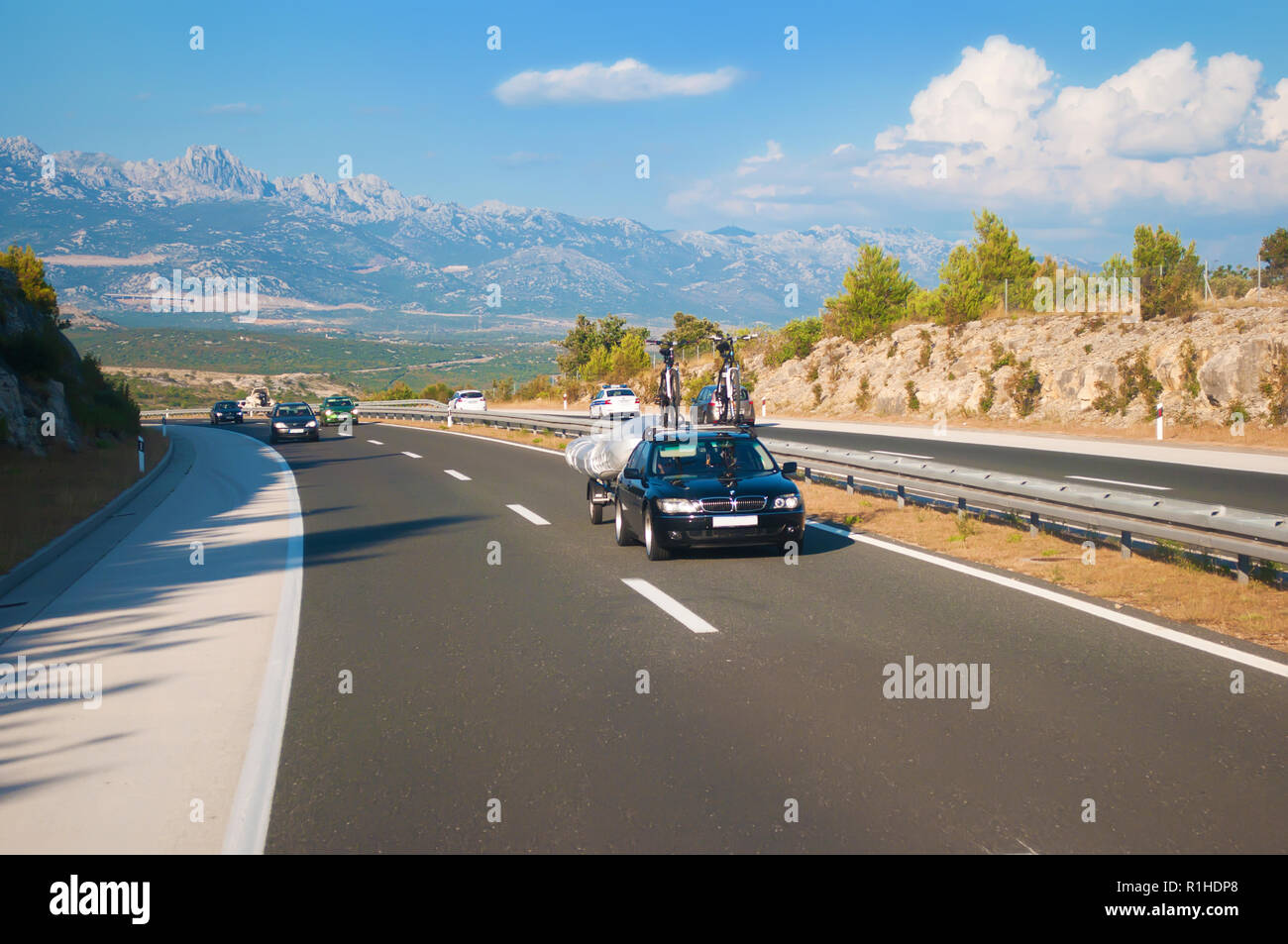 Two cars ride highway in hi-res stock photography and images - Alamy