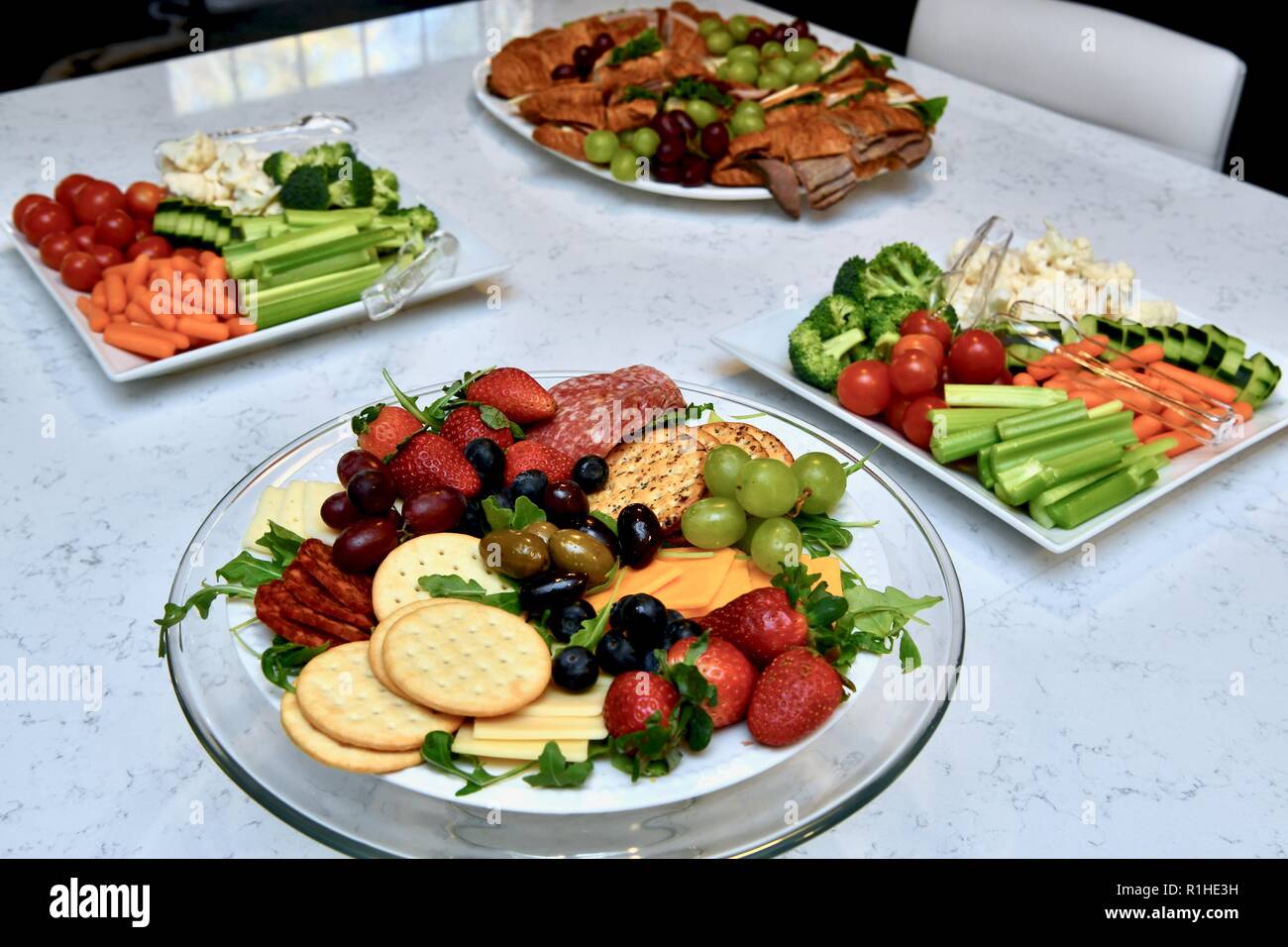 Table full of various food party platters Stock Photo - Alamy