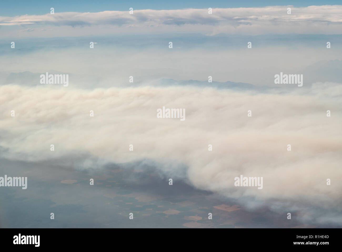 Aerial view of clouds and forest fire smoke, United States Stock Photo ...