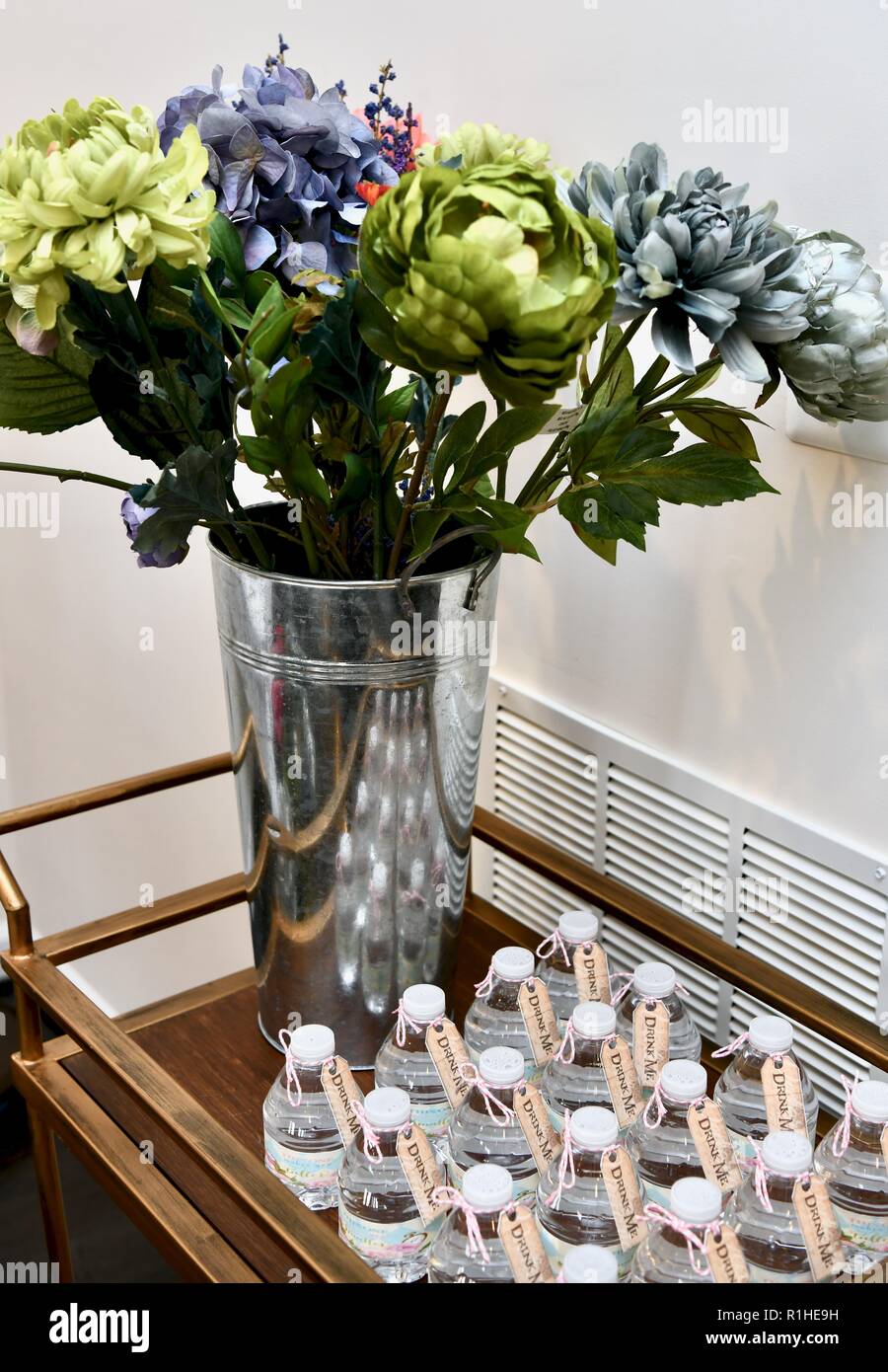 Small bottled water with decoration party tags on them for a birthday ...