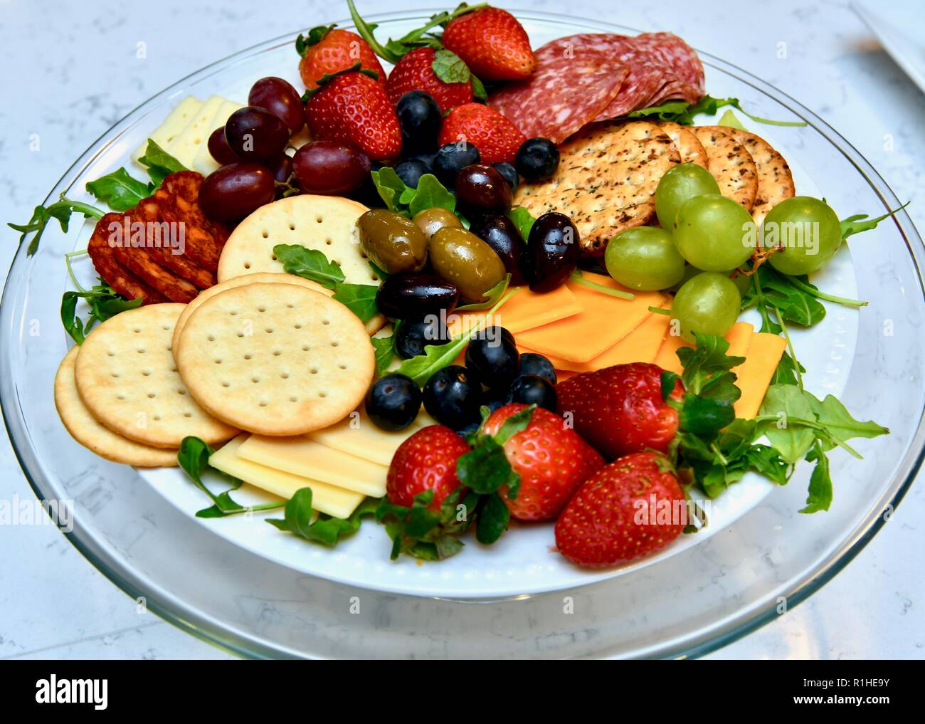 Appetizer plate consisting of meat, Cheese, and crackers Stock Photo ...