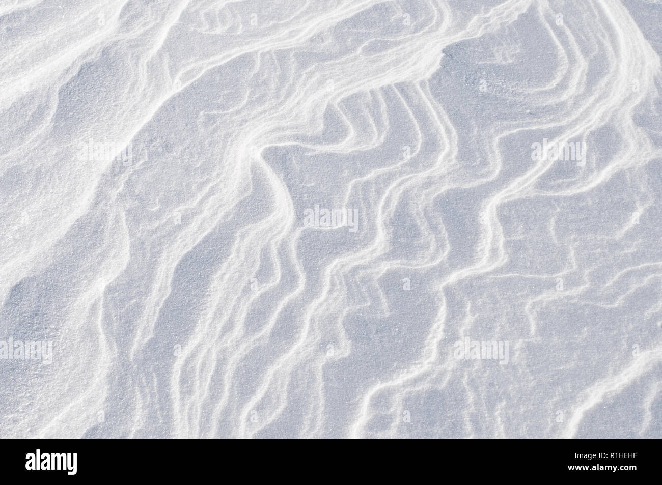 Wind sculpted patterns on snow surface Stock Photo - Alamy