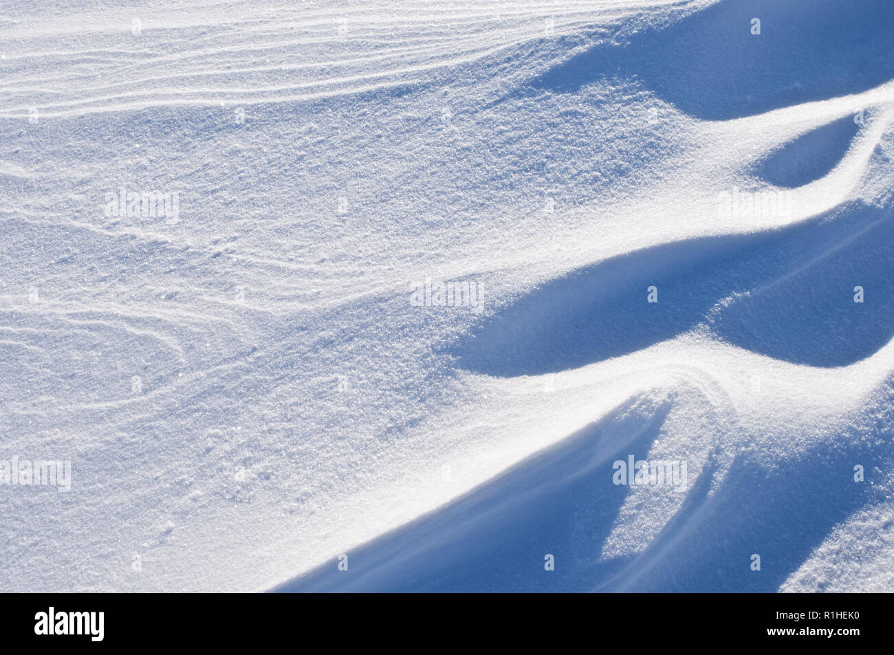 Wind sculpted patterns on snow surface Stock Photo - Alamy