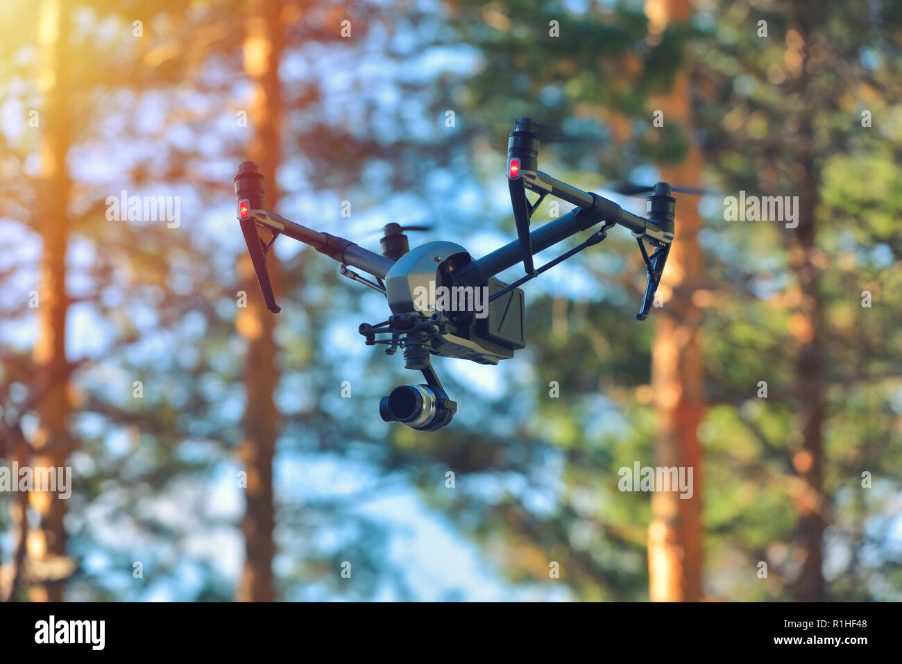 Flying drone on natural background Stock Photo - Alamy