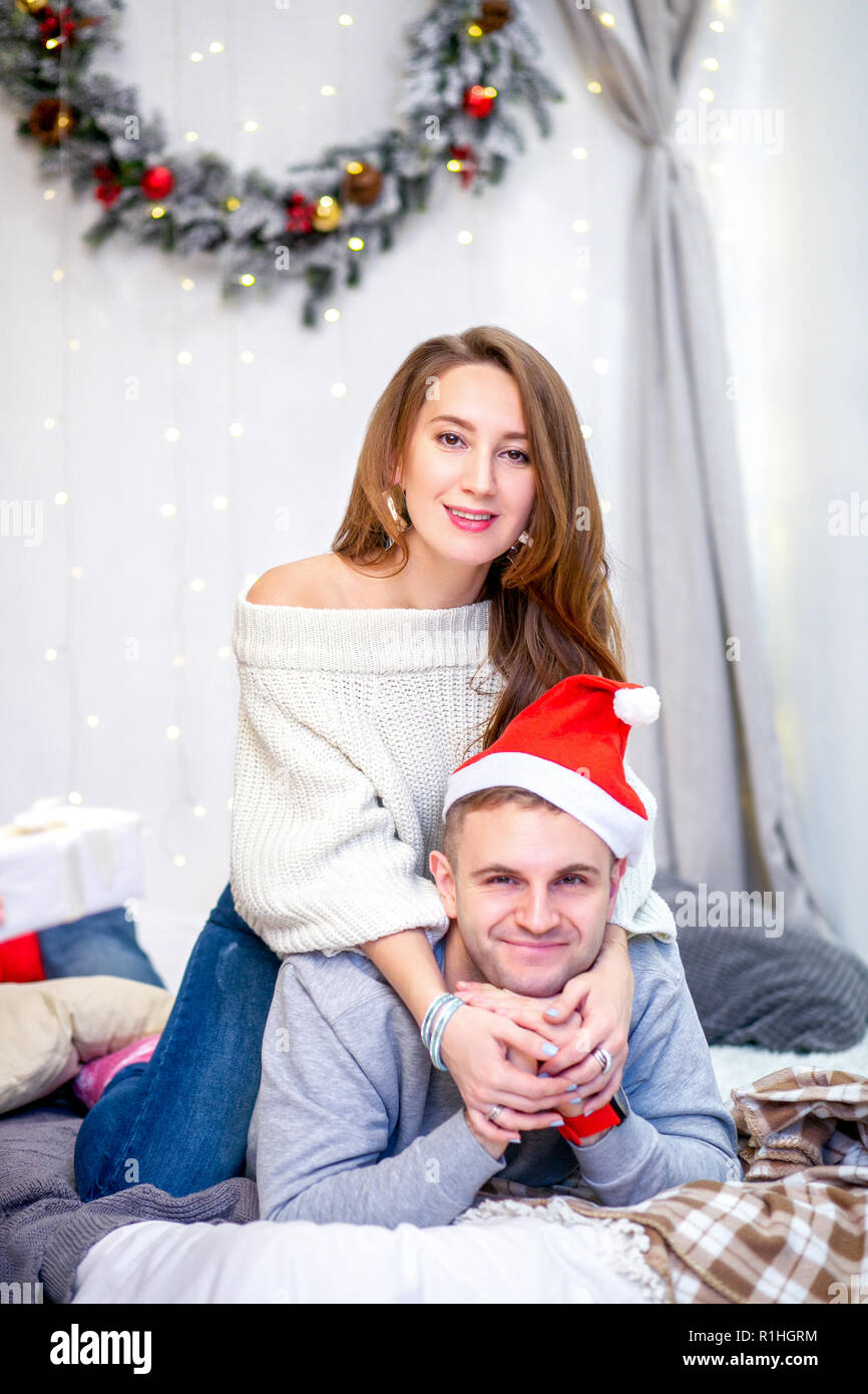 Happy family, father and mother in the morning in bedroom decorated for ...