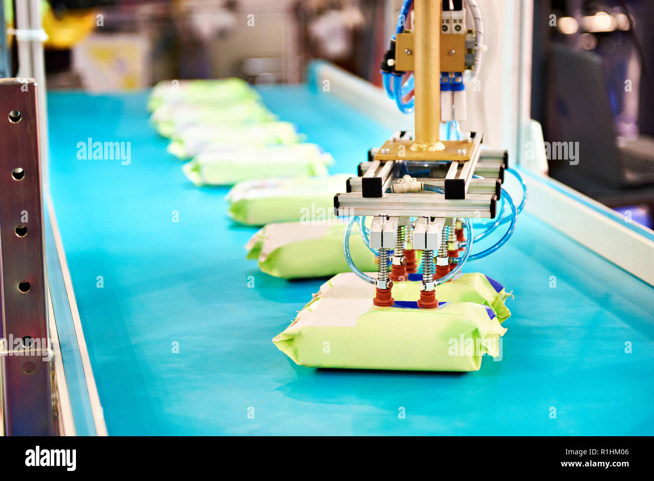 Hand robot manipulator for packaging products on conveyor Stock Photo ...