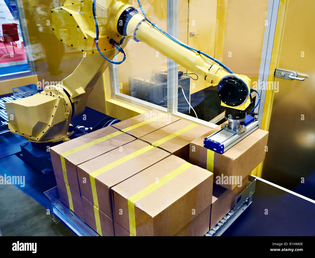 Standard multipurpose robot and cardboard boxes Stock Photo - Alamy