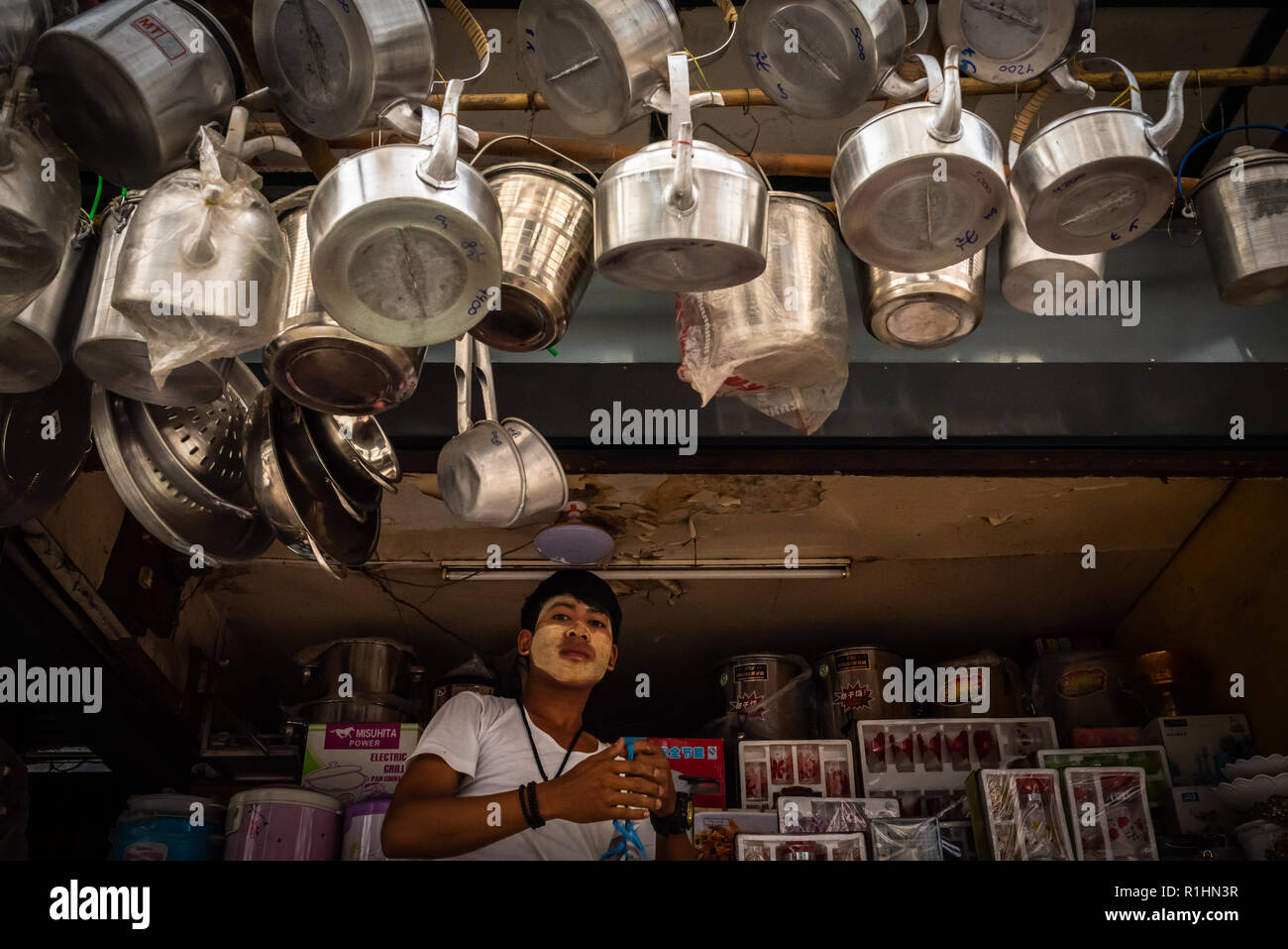 A vendor of pots and pans in his shop in Mandalay, Myanmar Stock Photo ...