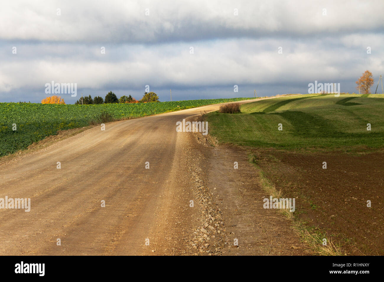 Country landscape with gravel road Stock Photo - Alamy