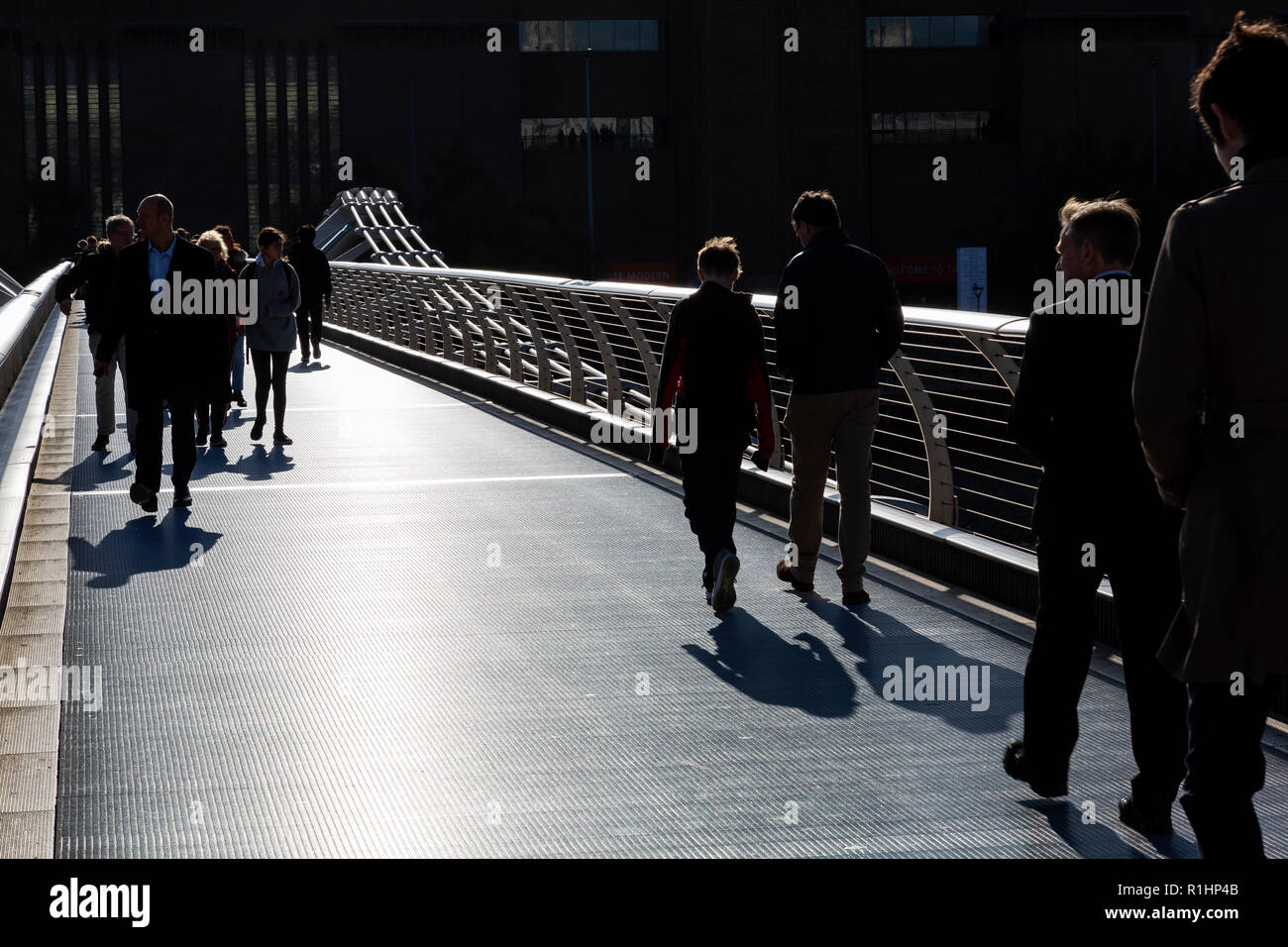 People walking over the Millennium Bridge (wobbly bridge) London ...
