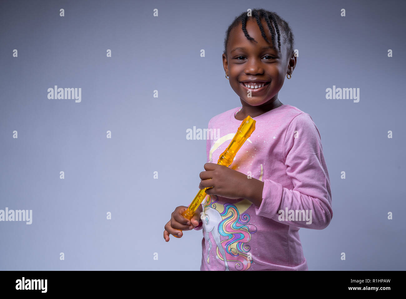 Little girl with recorder Stock Photo - Alamy