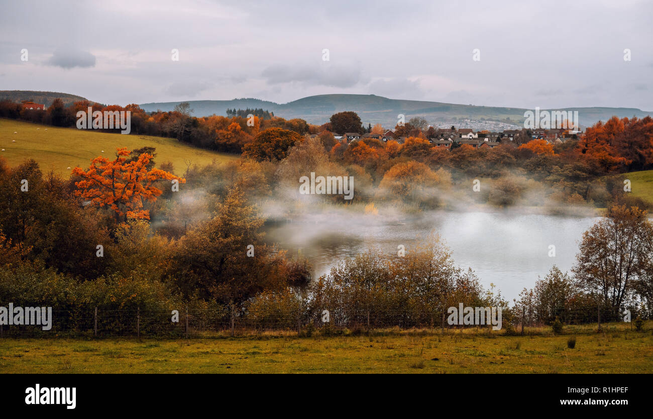 Mist rising from a lake at Autumn Fall time in South Wales UK Stock ...