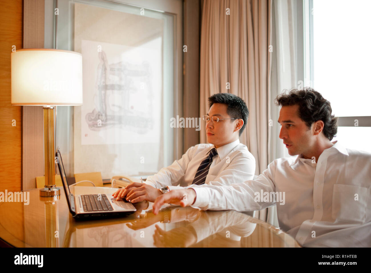 Two businessmen talking conference room hotel hi-res stock photography ...