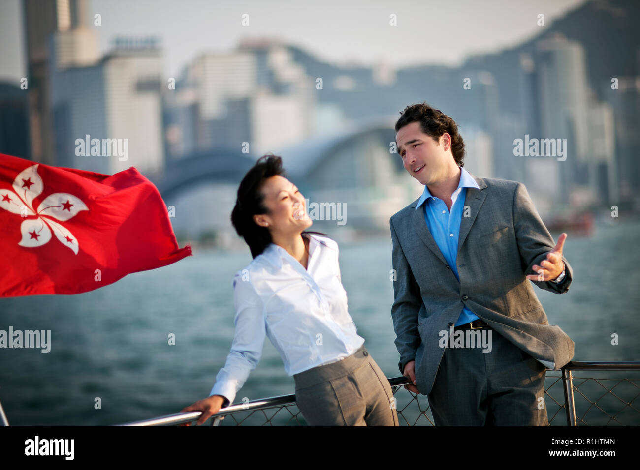 Two friends having a lively conversation on a boat Stock Photo - Alamy