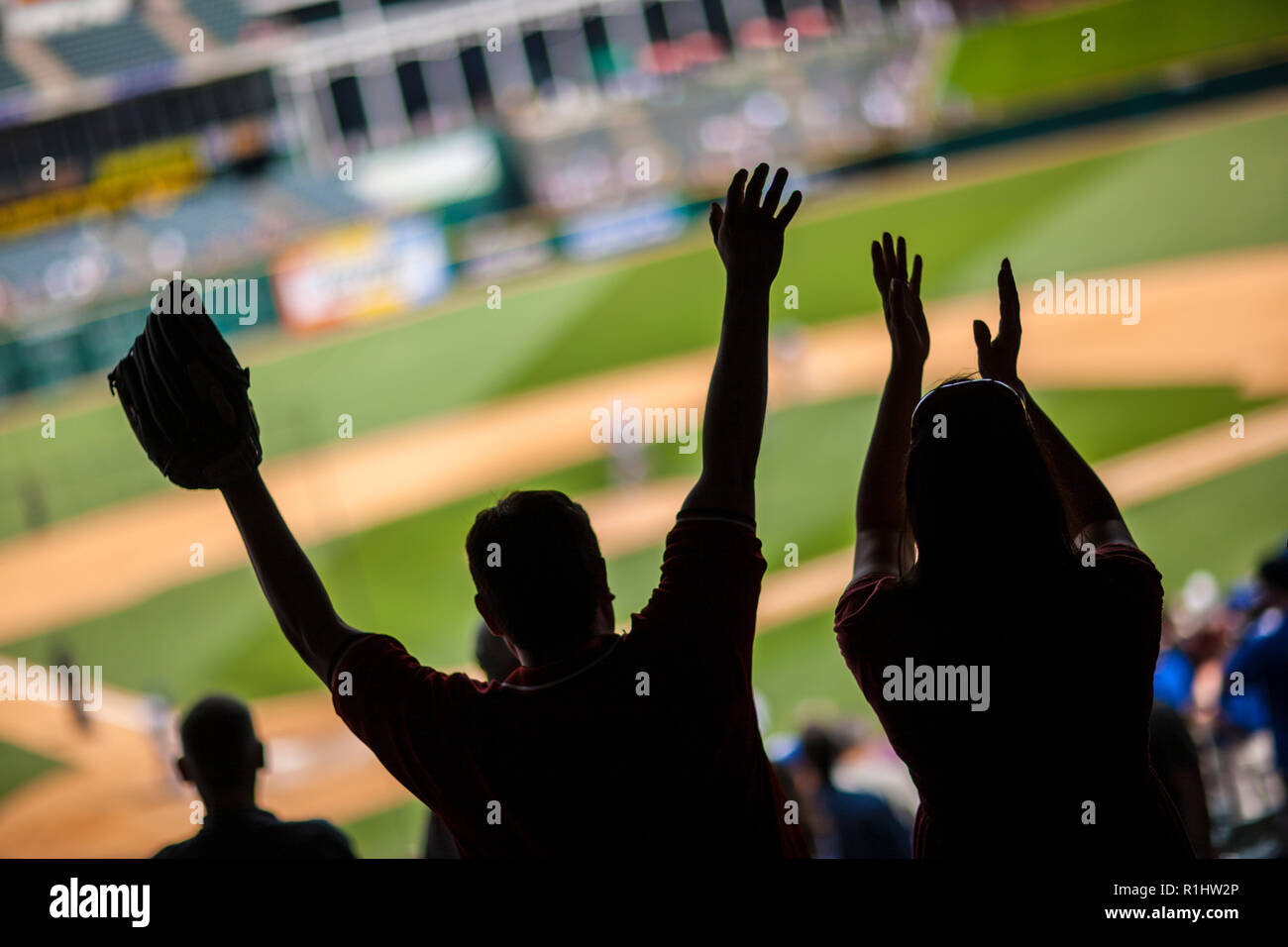 Family cheering on a baseball game at a sports stadium Stock Photo - Alamy