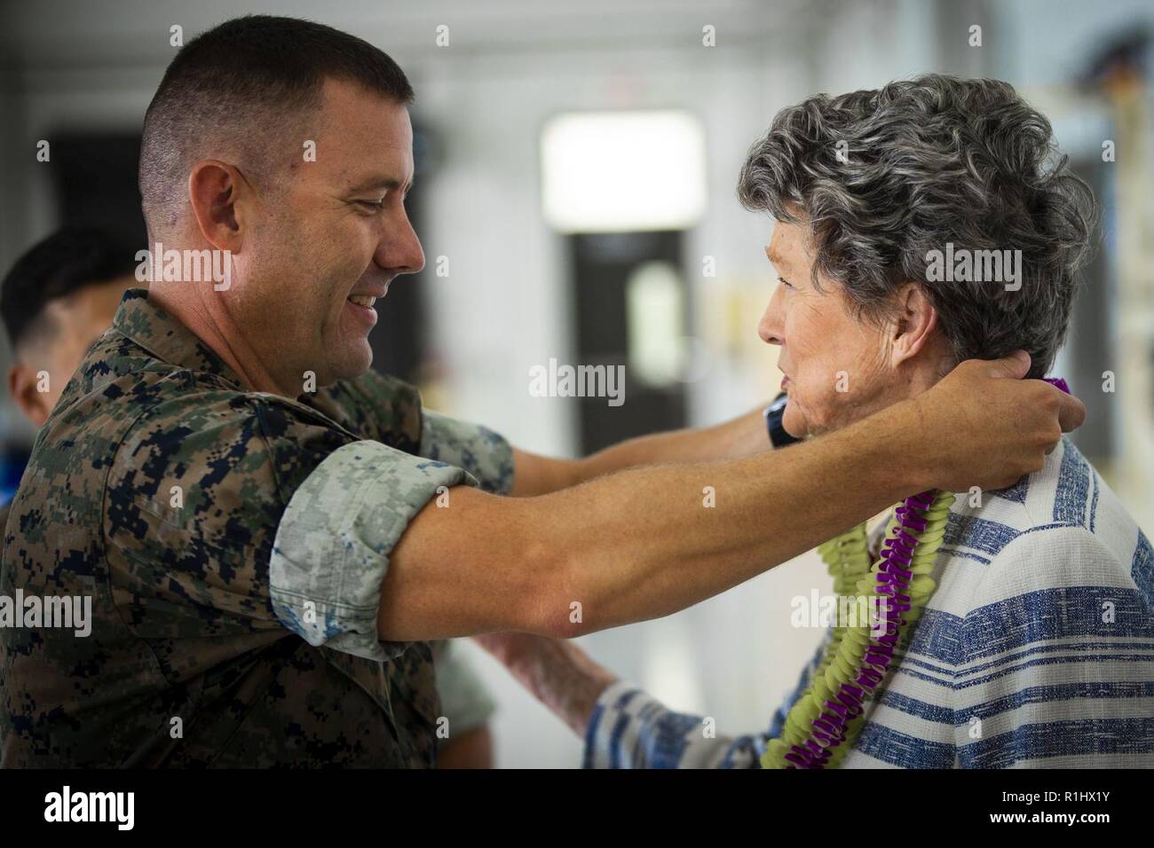 U.S. Marine Corps Lt. Col. Brian Clifton, left, commanding officer ...