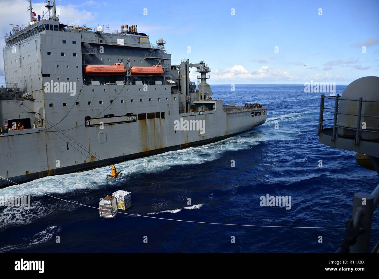 EAST CHINA SEA (Sept. 22, 2018) - Crew members aboard the dry cargo and ...