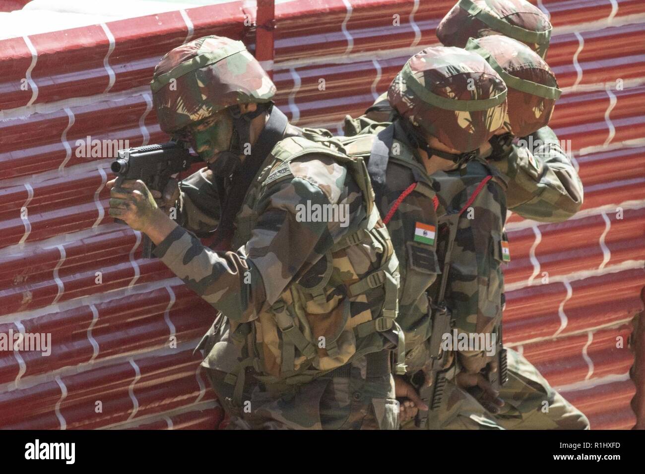 Soldiers with the Indian army stack up and prepare to enter a shoot ...