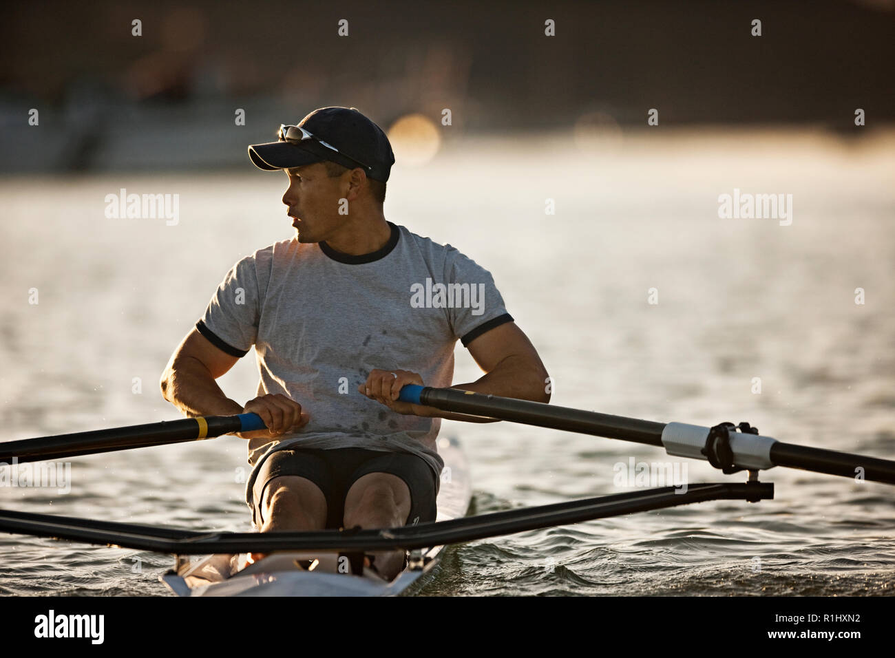 Mid-adult man sea rowing Stock Photo - Alamy