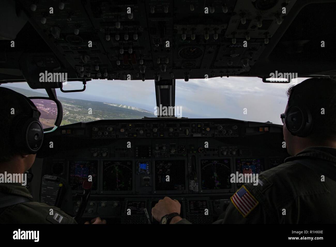 U.S. Navy pilots fly a P-8A Poseidon during a sink exercise, part of ...