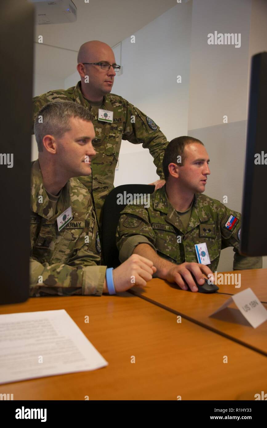 Maj. Hubbard supervises collaborative work with a Slovak soldier and ...