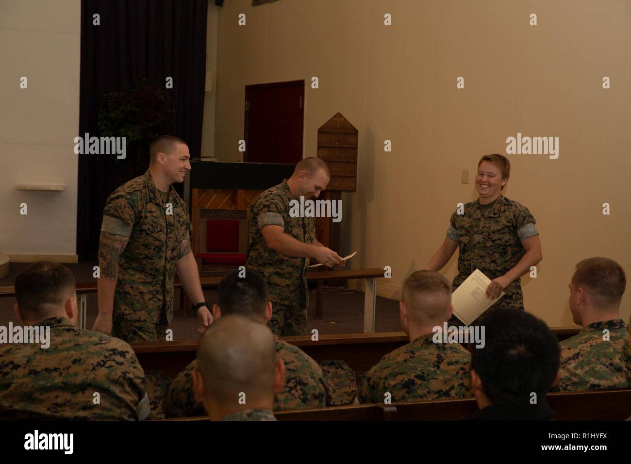 U.S. Marine Sgt. Ariel Lahtinen, right, smiles after receiving her ...