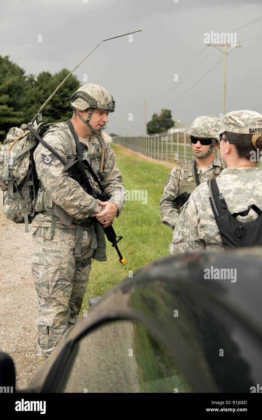 To the left, Staff Sgt. Bo Hall and Tech. Sgt. Christopher Barett, both ...