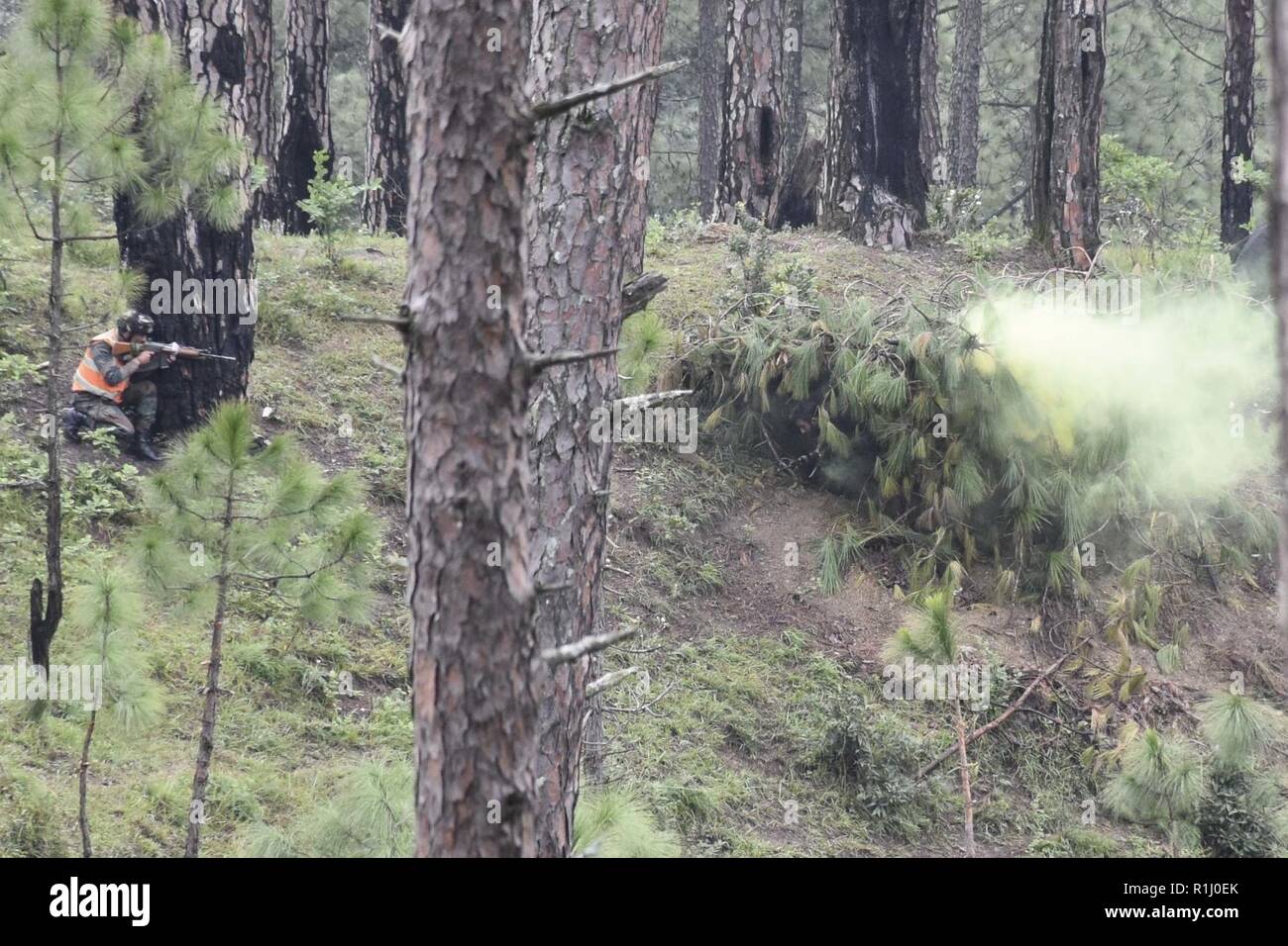 An Indian army soldier waits for the opposing force to leave their ...