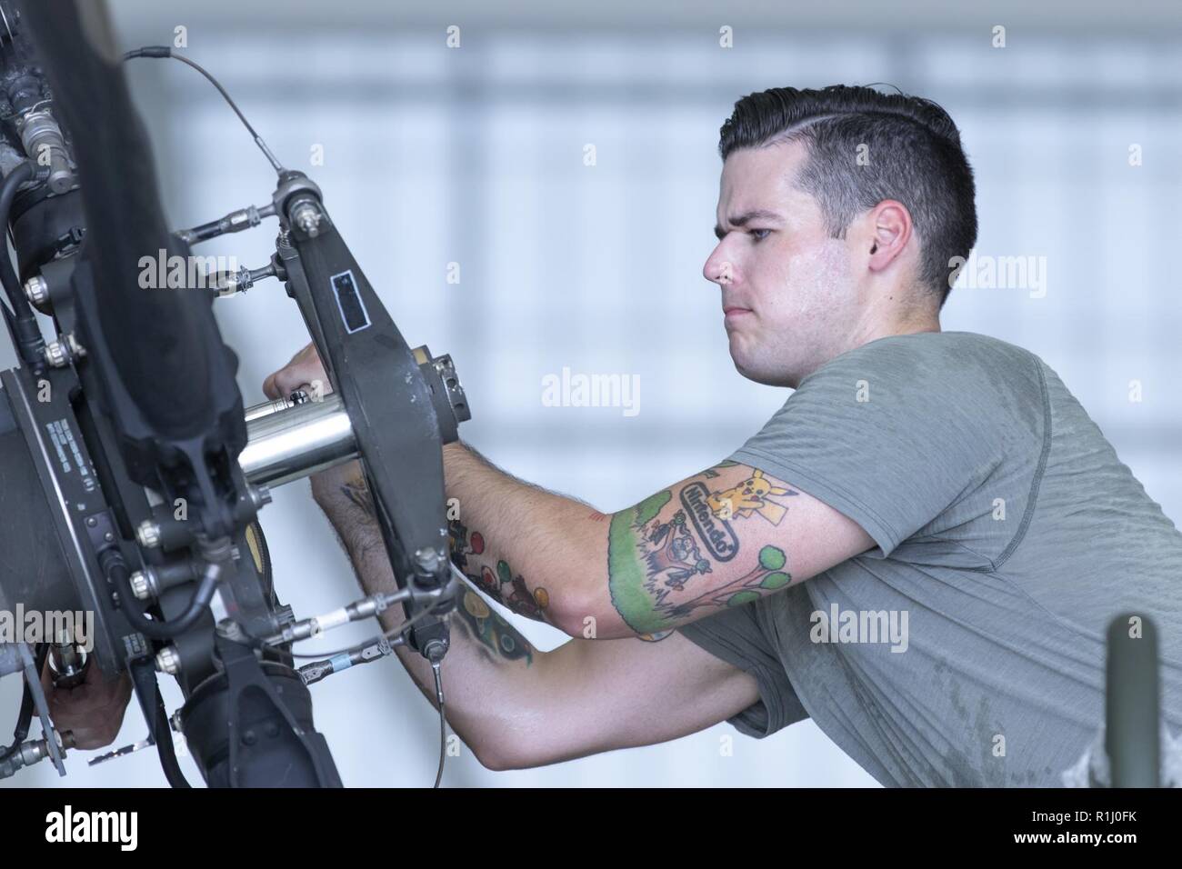 Spc. Michael Pearson, a helicopter repairer, 1st Battalion, 207th ...