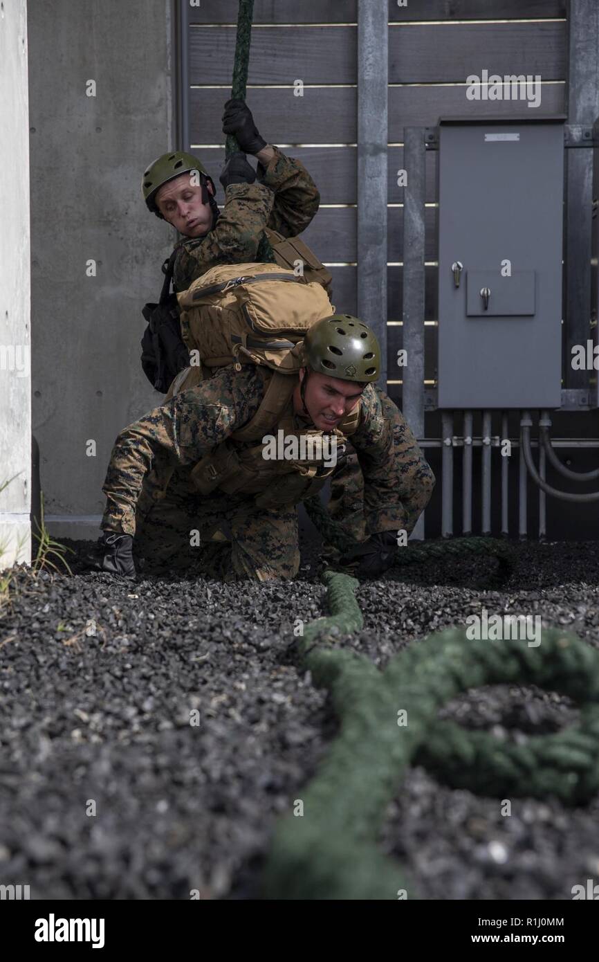U.S. Marines conduct fast rope drills during helicopter rope suspension ...