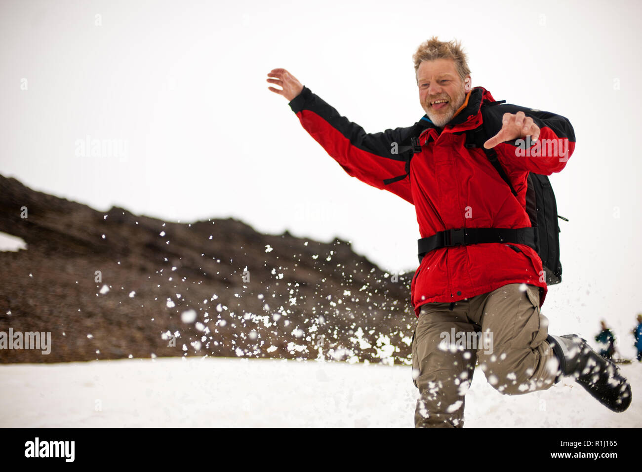 Man running through the snow hi-res stock photography and images - Alamy