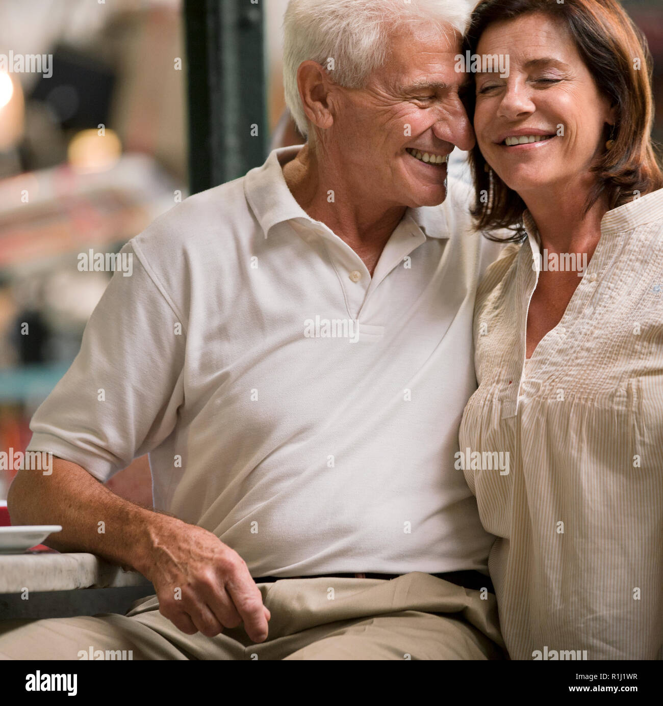 Senior man smiles as he nuzzles his wife's cheek Stock Photo - Alamy
