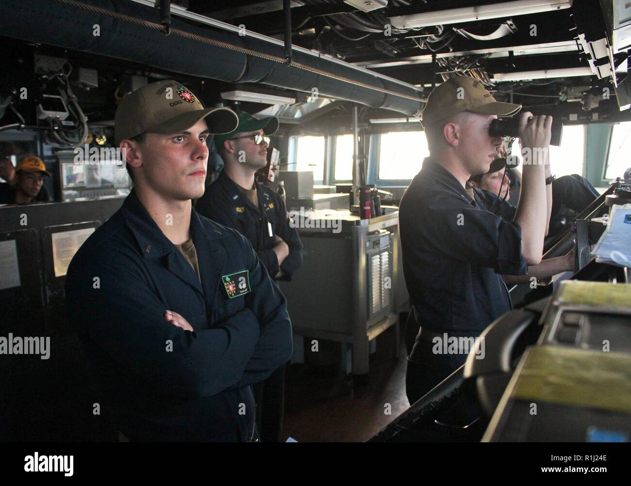 STRAIT OF HORMUZ (Sept. 24, 2018) Ensign Spencer Bird, left, and junior ...